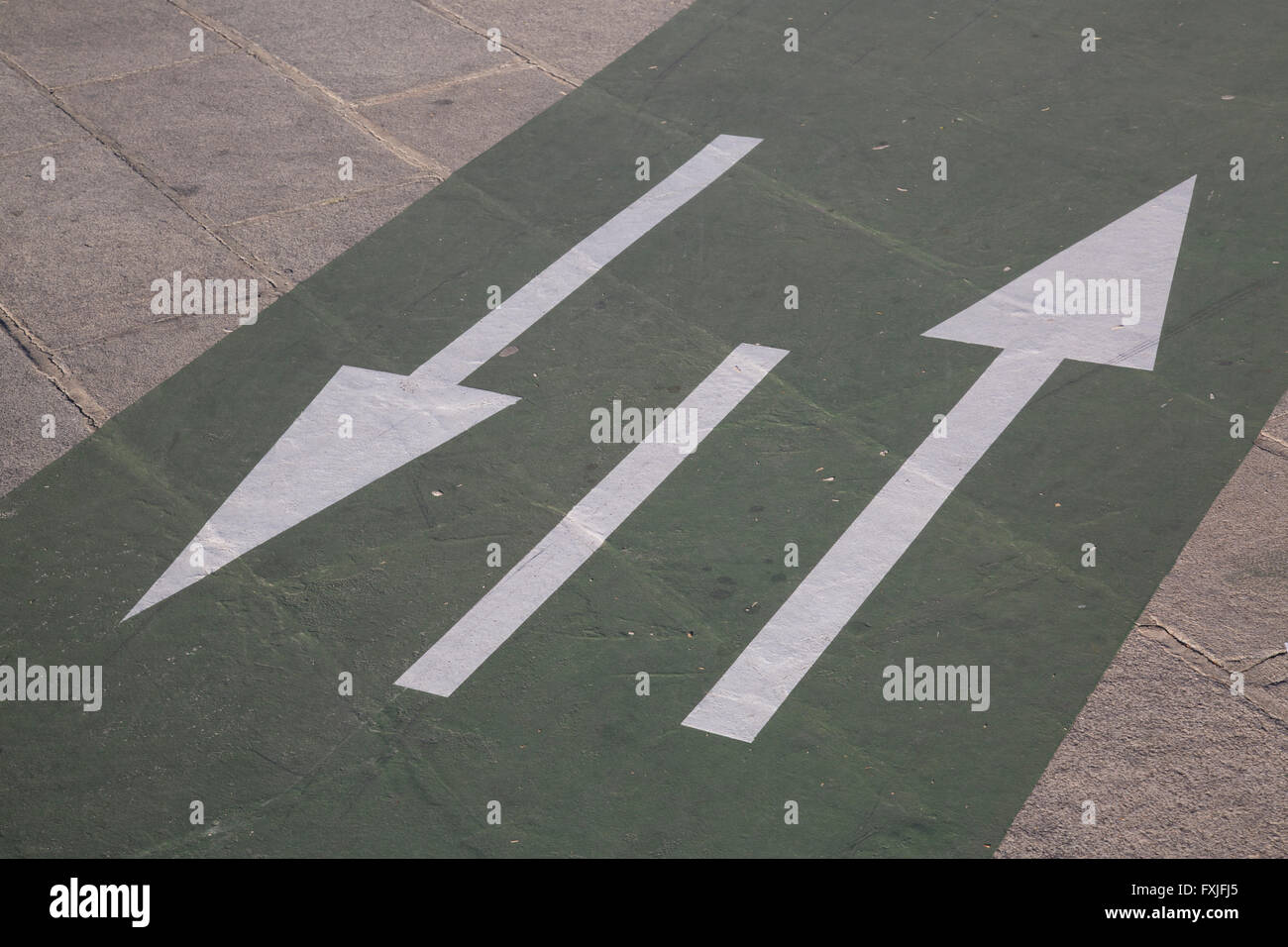 Double Arrow Sign on Cycle Path Stock Photo - Alamy