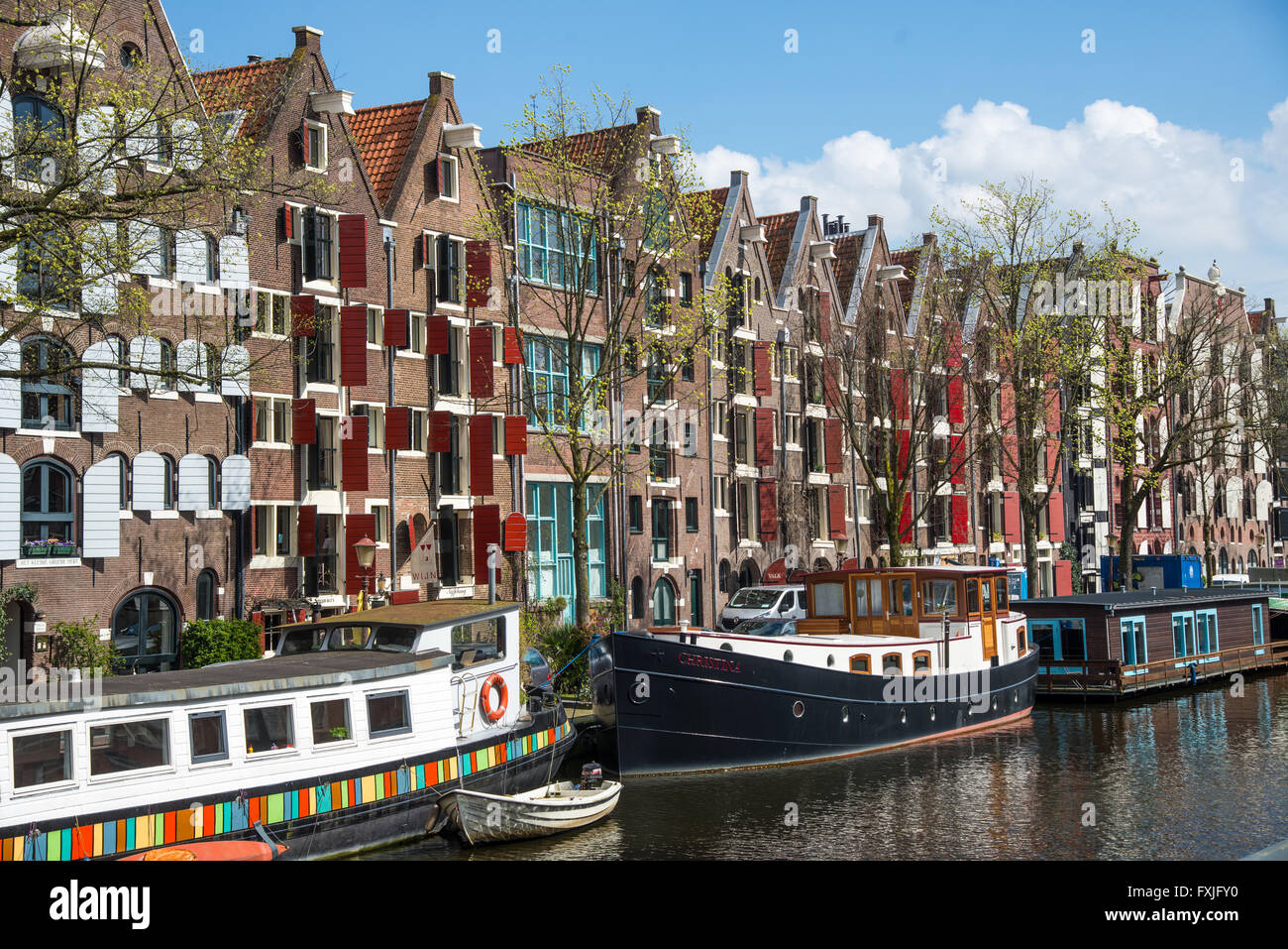 facades of historic buildings alongside the canals in amsterdam holland ...