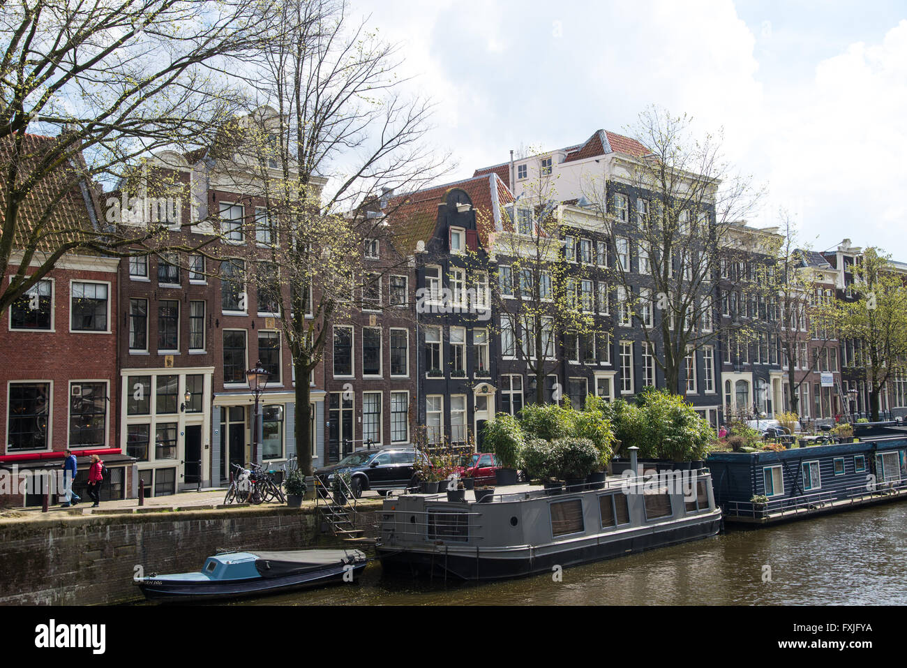 facades of historic buildings alongside the canals in amsterdam holland ...