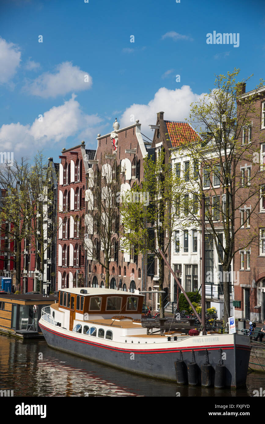 facades of historic buildings alongside the canals in amsterdam holland ...