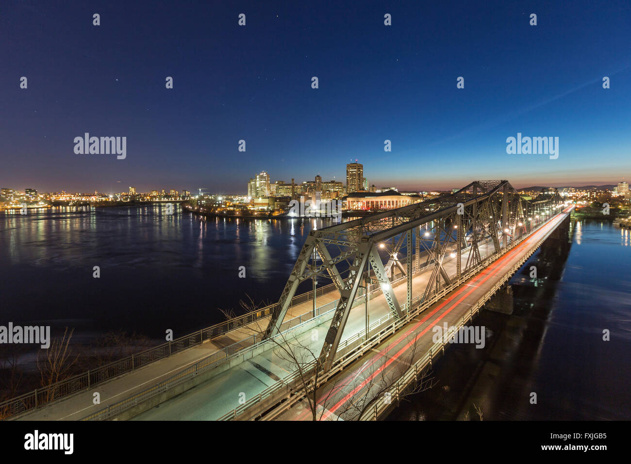 City scape at dusk landscape with river, buildings and bridge Stock ...