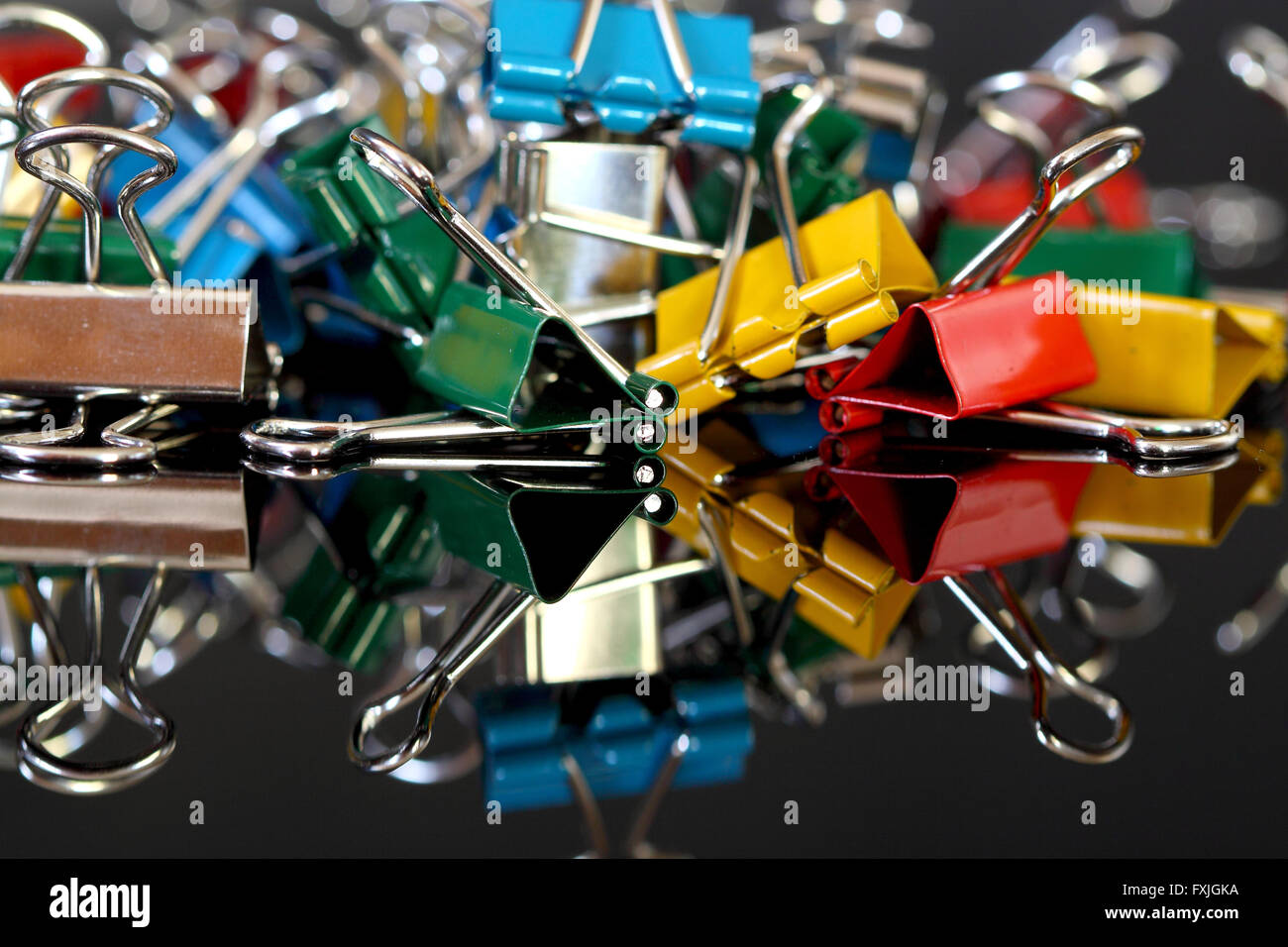 Bulldog clips color reflected Stock Photo - Alamy