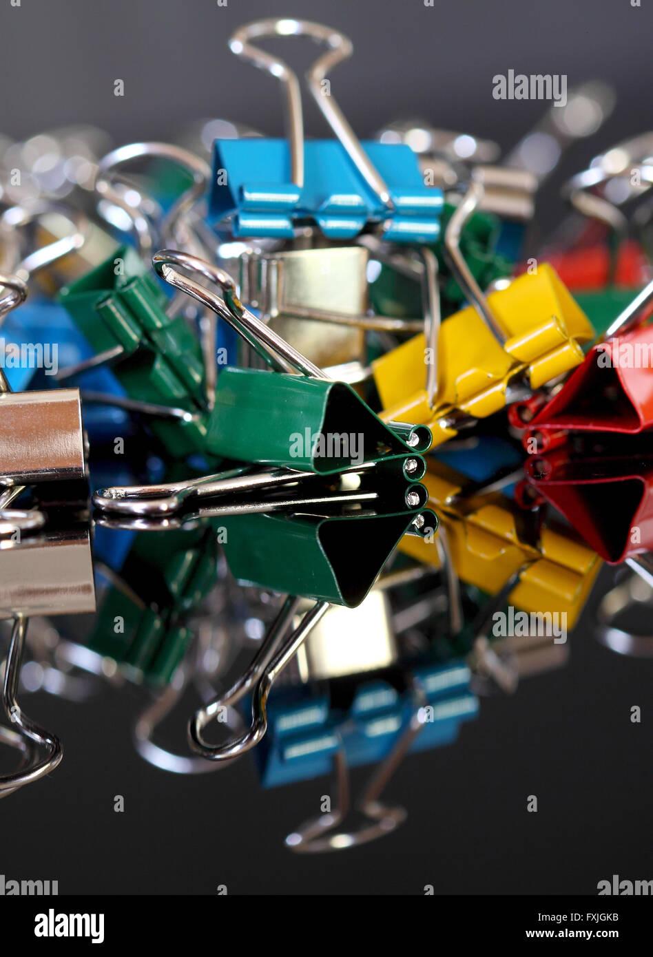 Bulldog clips color reflected Stock Photo - Alamy