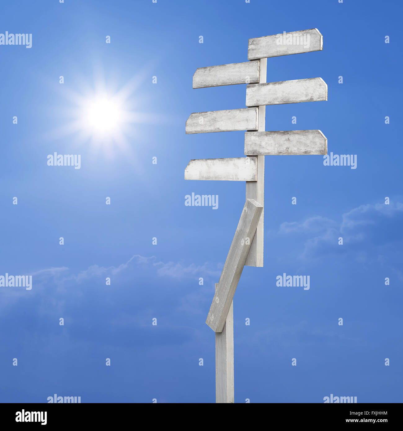 wooden direction sign with blank spaces for text on beautiful sunlight ...