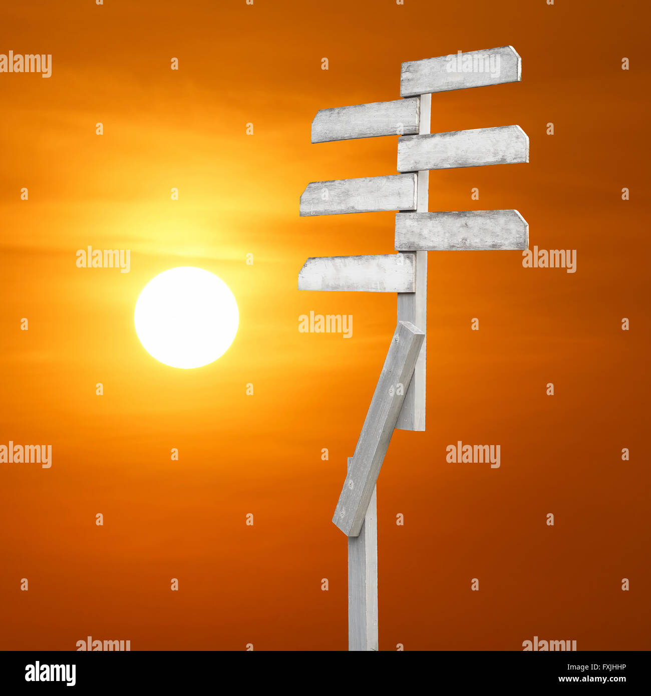 wooden direction sign with blank spaces for text on beautiful sunset ...