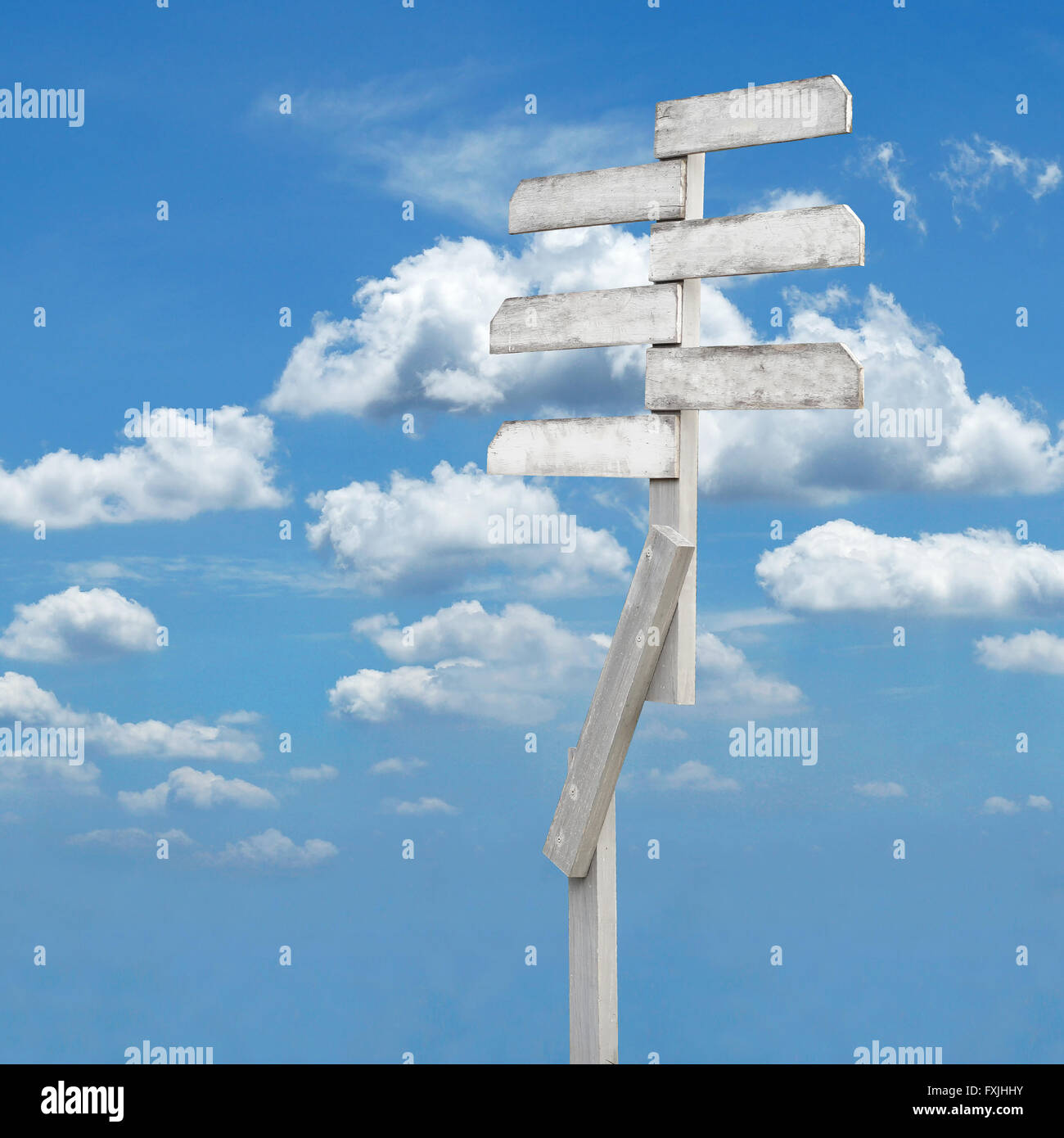 wooden direction sign with blank spaces for text on beautiful sky ...