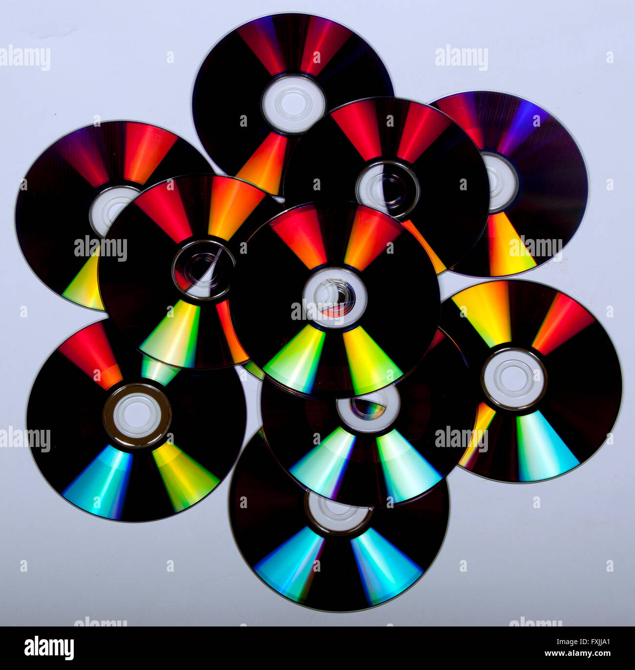 Abstract reflections colors and patterns on collection of compact discs ...