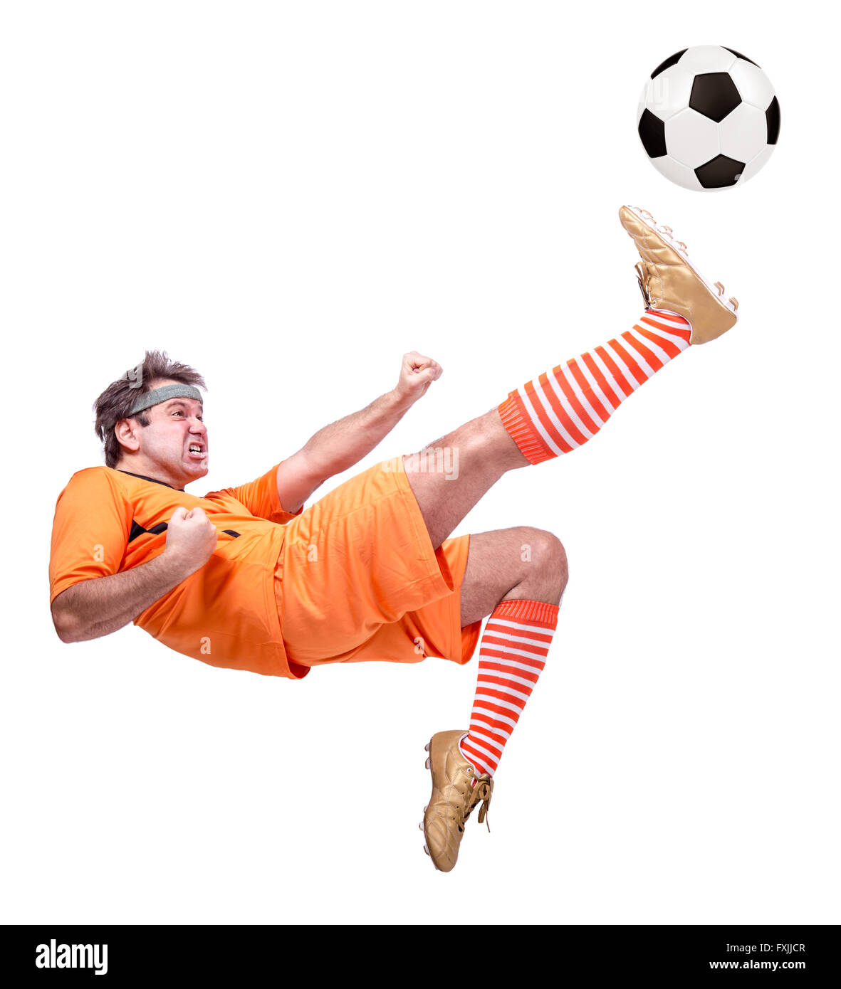 Soccer football player kicking the ball isolated on a white background ...
