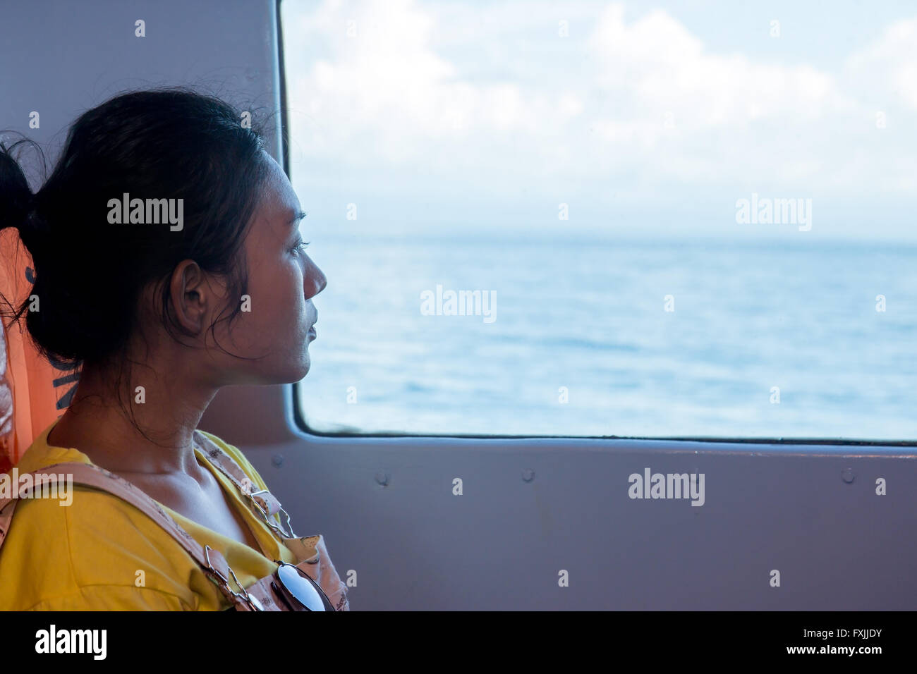 passenger on a ship looking out the window at the sea Stock Photo - Alamy