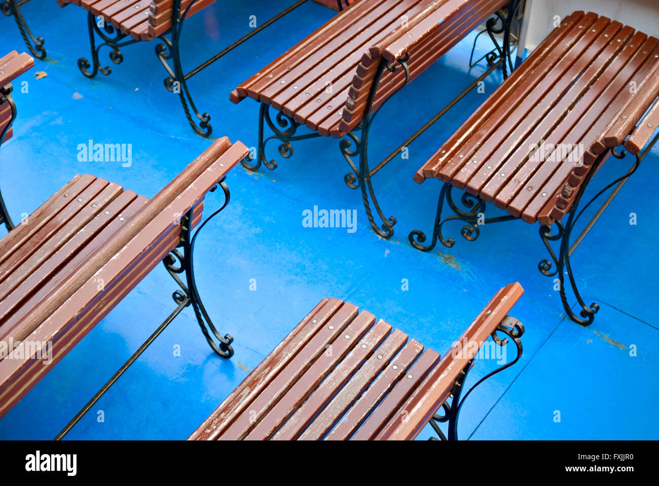 Brown wooden benches on the blue floor. Top view Stock Photo - Alamy