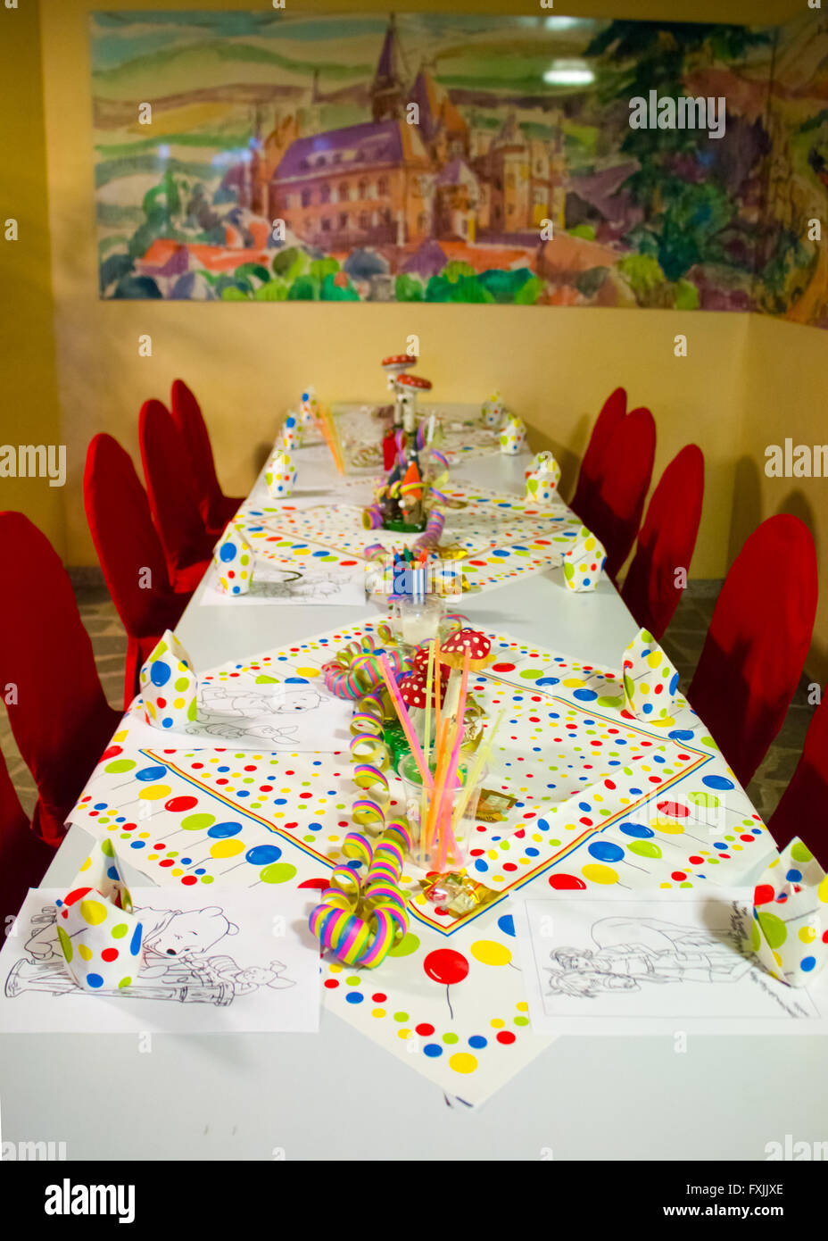Hide and seek. Group of little cheerful kids sitting at table during ...