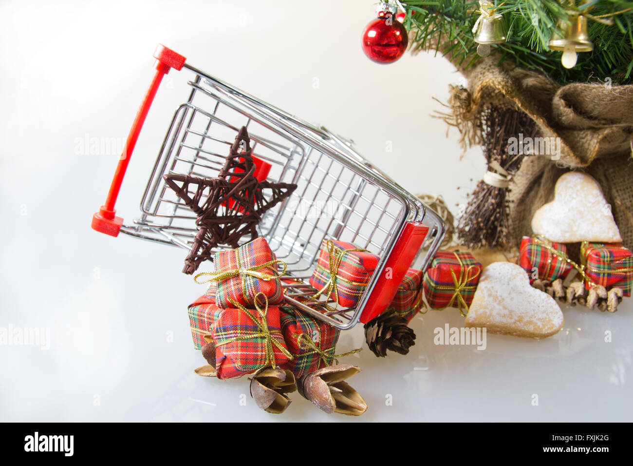Shopping cart filled with gifts Stock Photo - Alamy