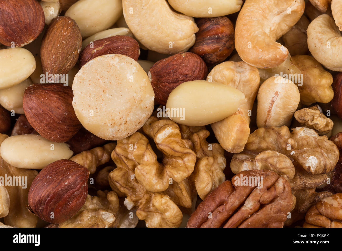 lot of different types of nuts mix for background Stock Photo - Alamy