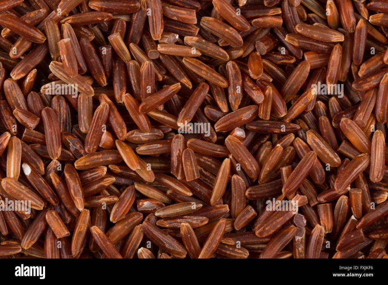 close up of background of raw red rice Stock Photo - Alamy