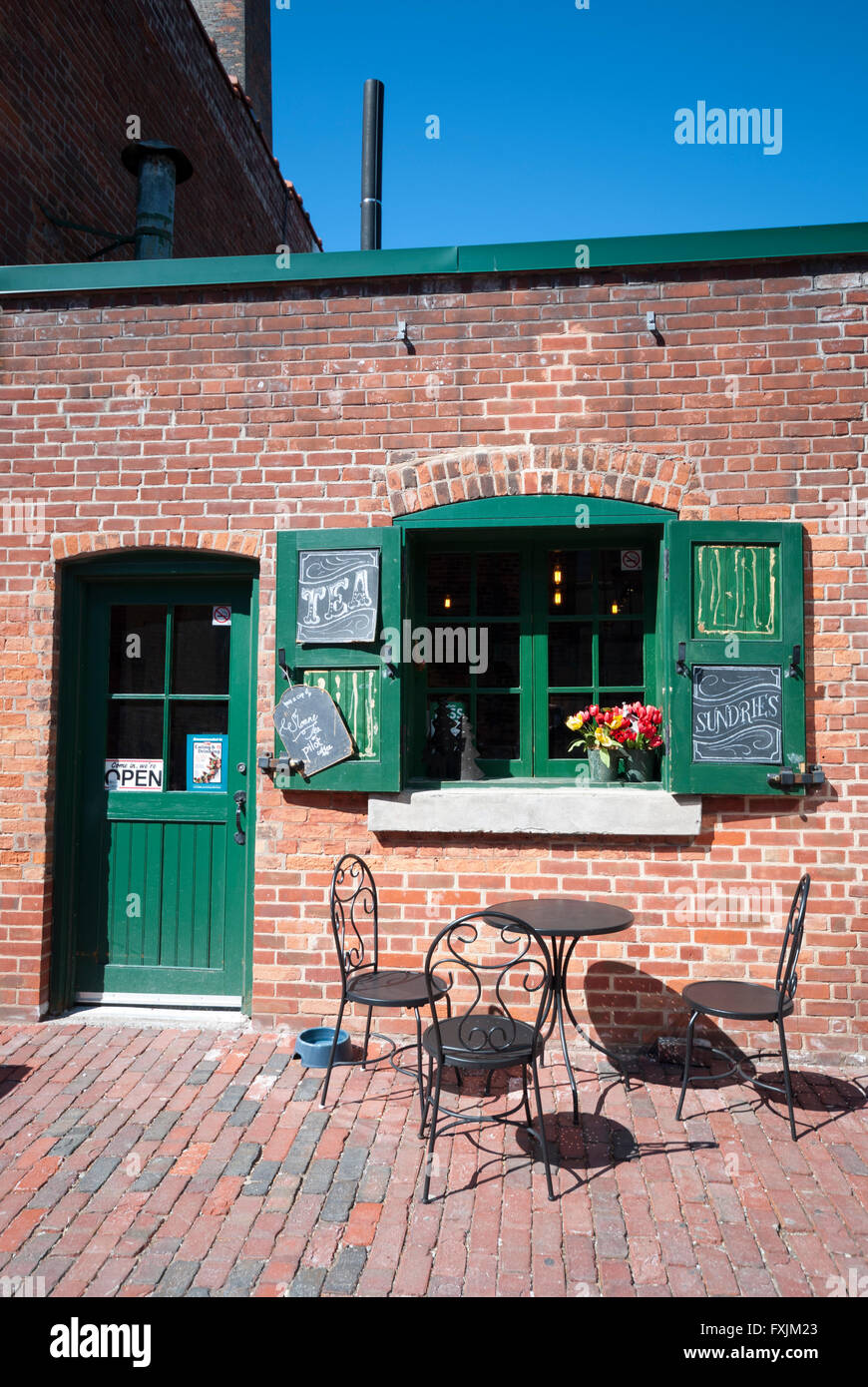 A small outdoor cafe in the popular Distillery district, a tourist and ...