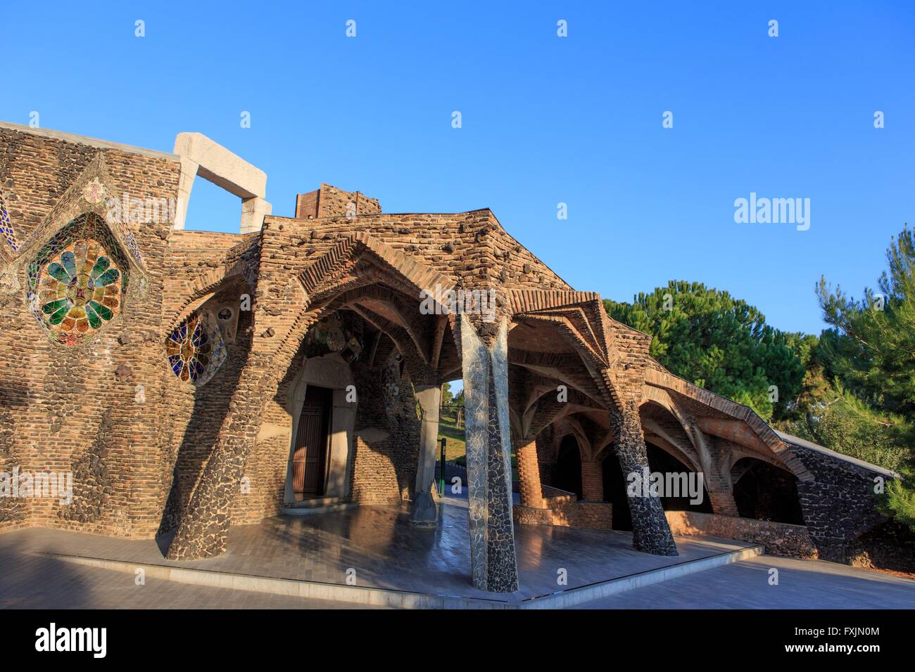 The distinctive facade of the Colonia Guell in Barcelona, Spain Stock ...