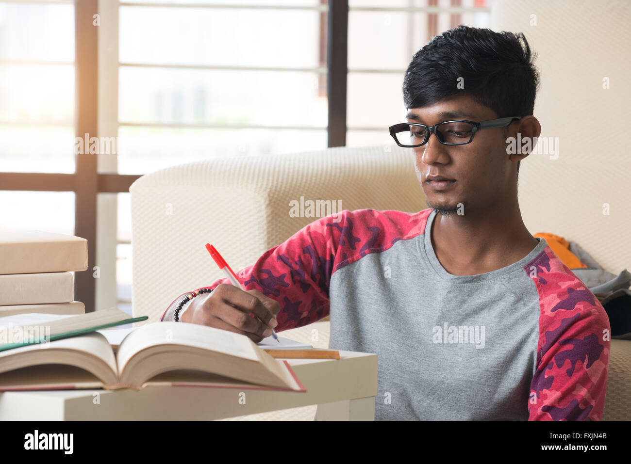 indian college student doing homework Stock Photo - Alamy