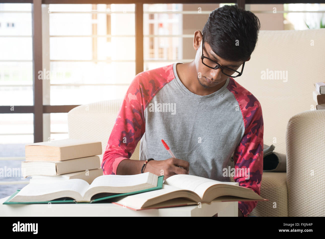 indian college student doing homework Stock Photo - Alamy