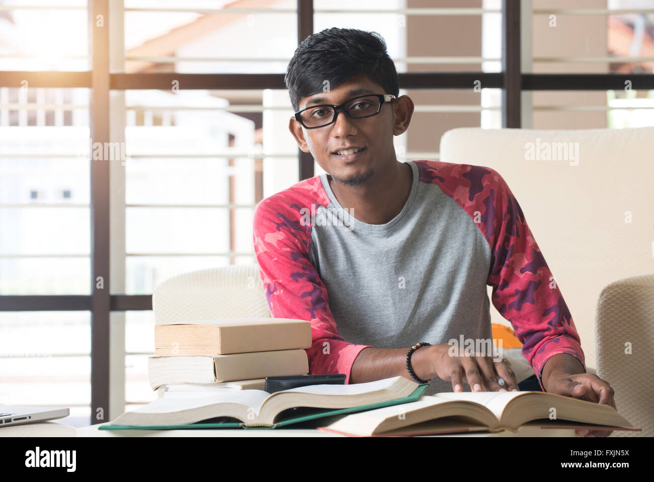 indian college student doing homework Stock Photo - Alamy