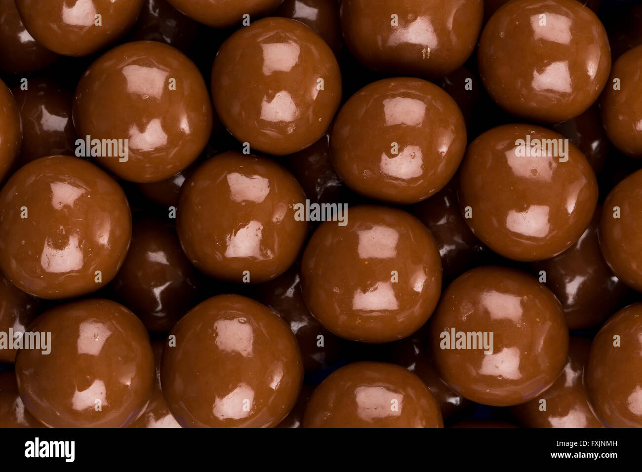 Multiple chocolate ball candies composition, isolated over the white ...