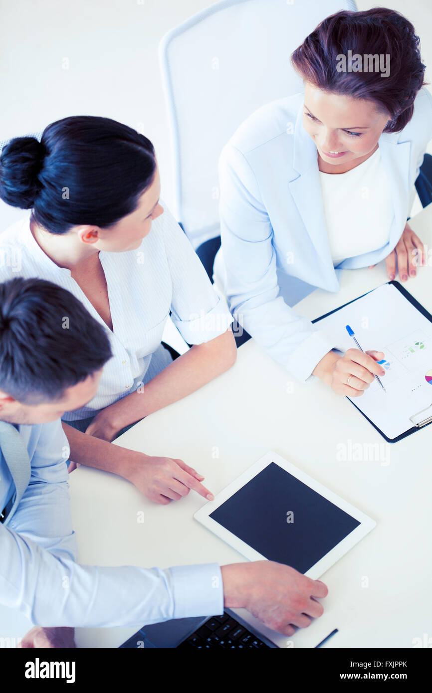 Business people discussing tablet charts hi-res stock photography and ...