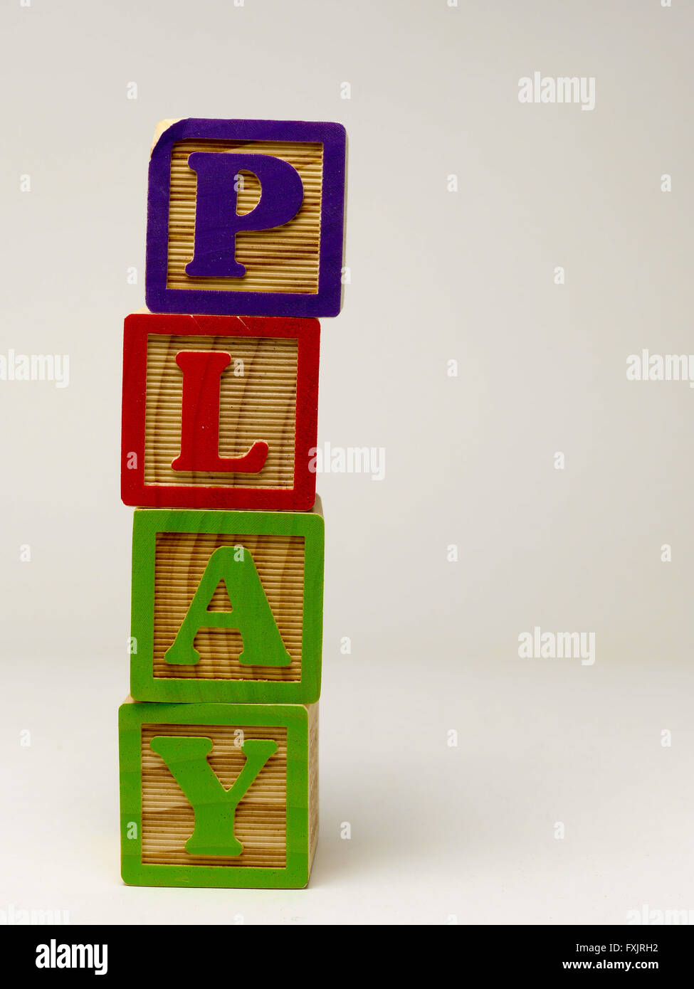 Kid's building blocks spelling the word play Stock Photo - Alamy