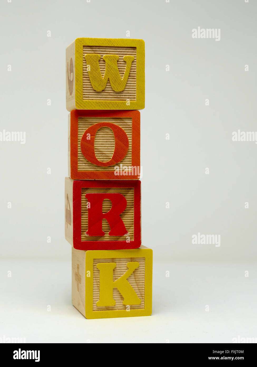 Kid's building blocks spelling the word work Stock Photo - Alamy