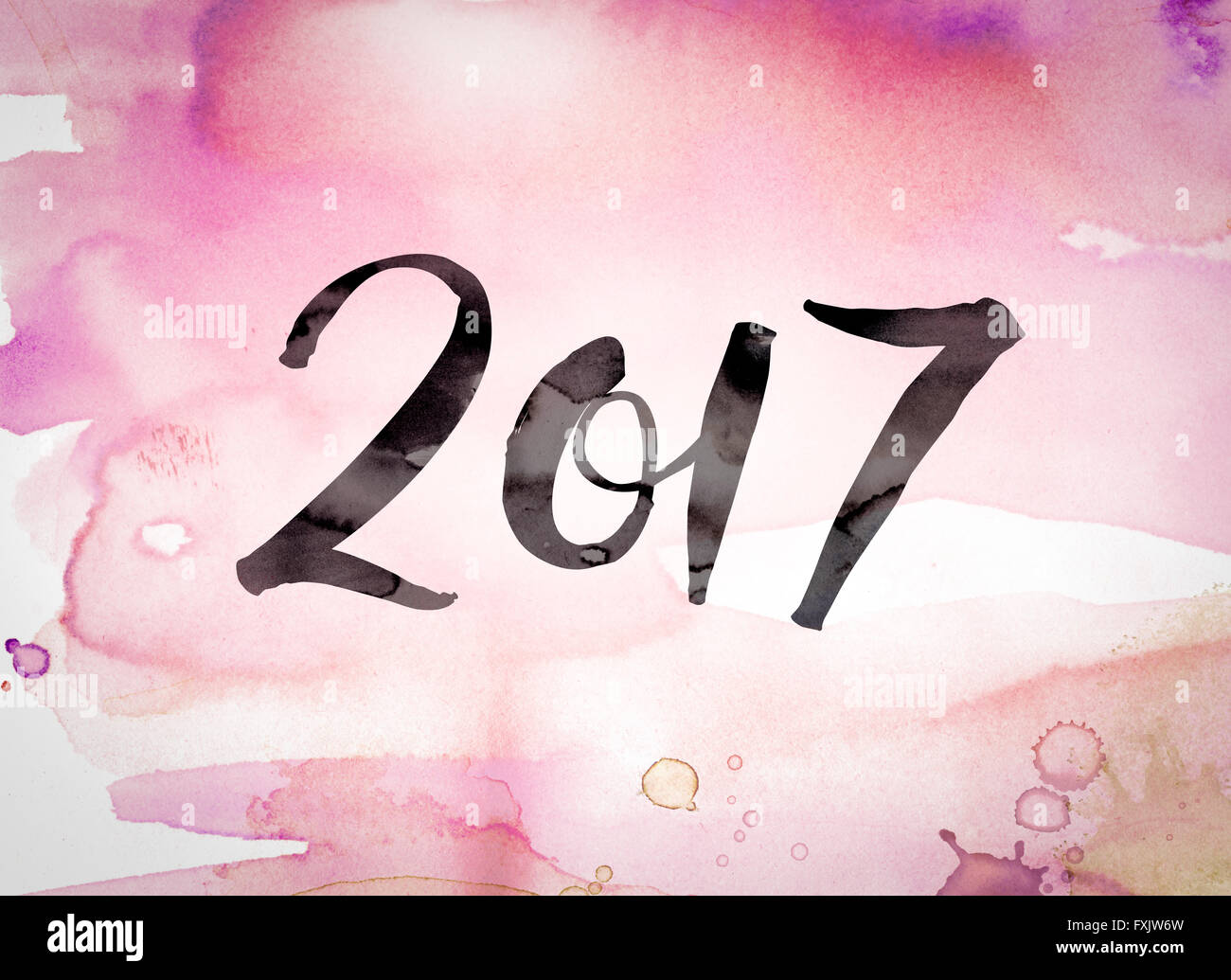 The word "2017" written in black paint on a colorful watercolor washed ...