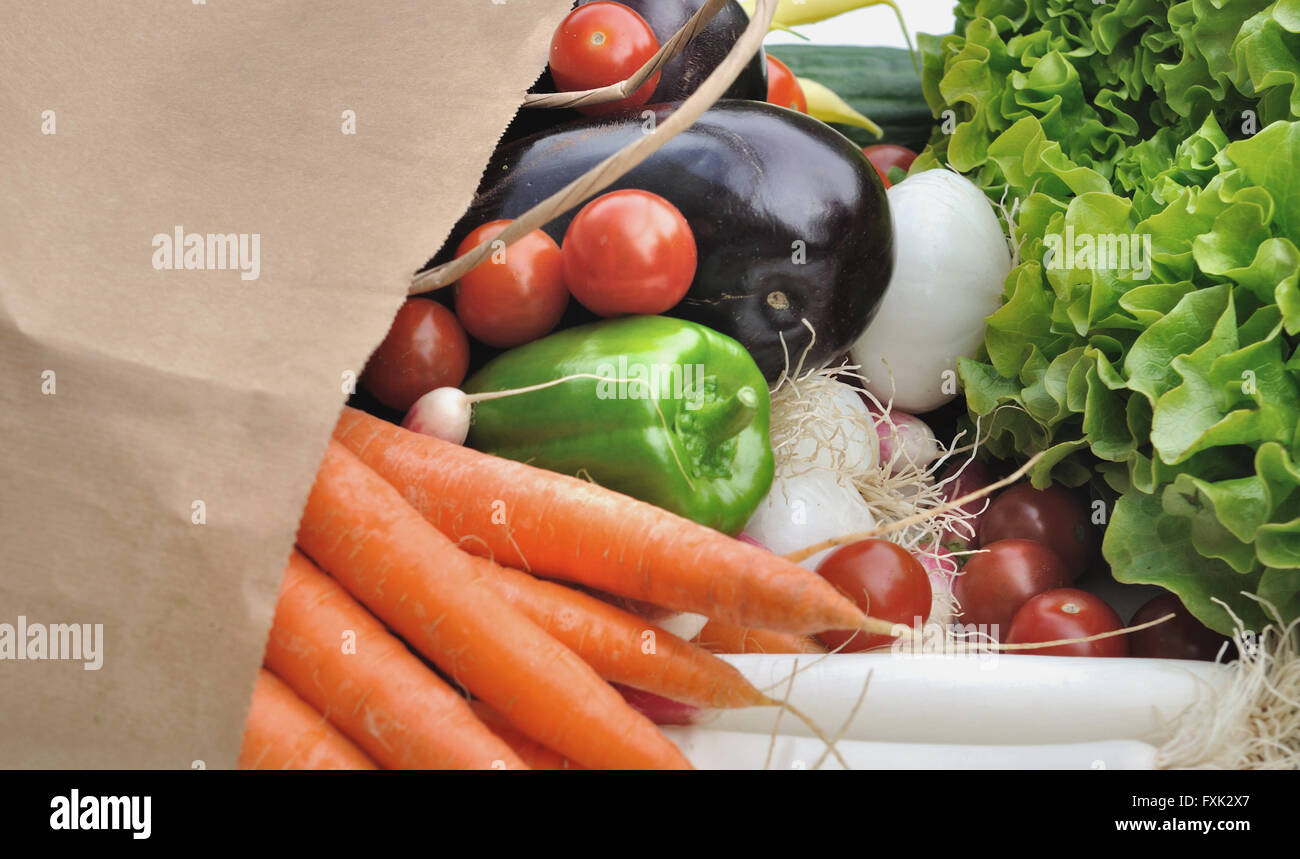 various fresh vegetable spilled a paper bag Stock Photo - Alamy
