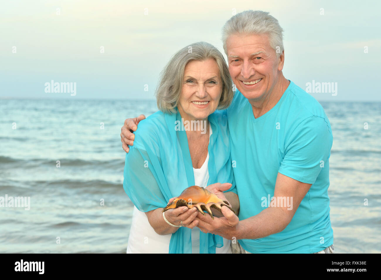 elderly couple rest at tropical resort Stock Photo - Alamy