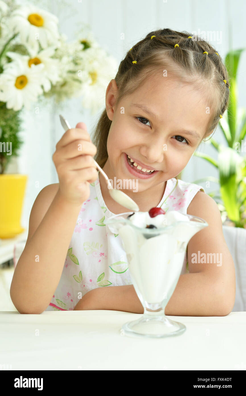 Girl eating sweet dessert with berries Stock Photo - Alamy