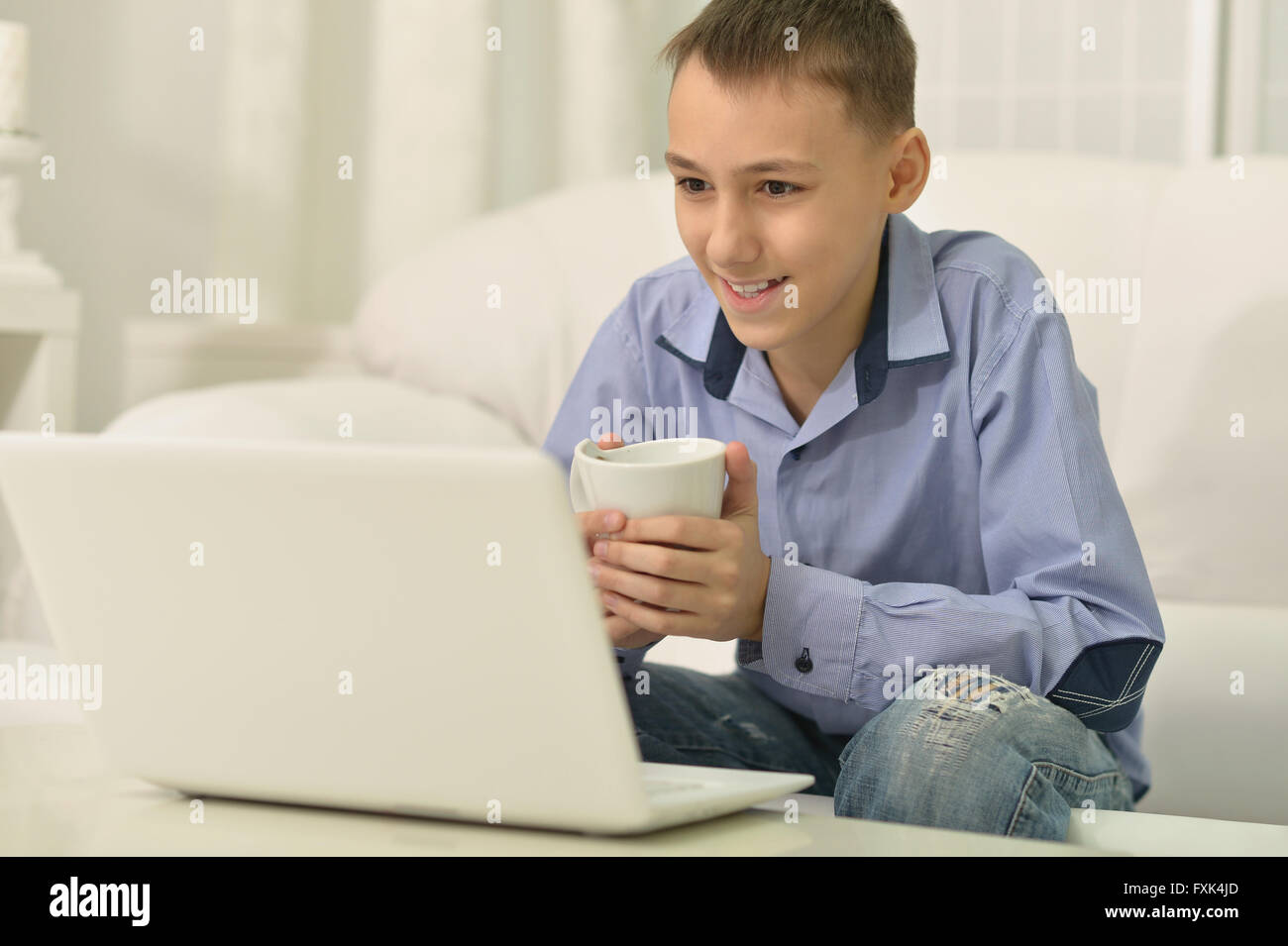 Young boy and laptop computer Stock Photo - Alamy