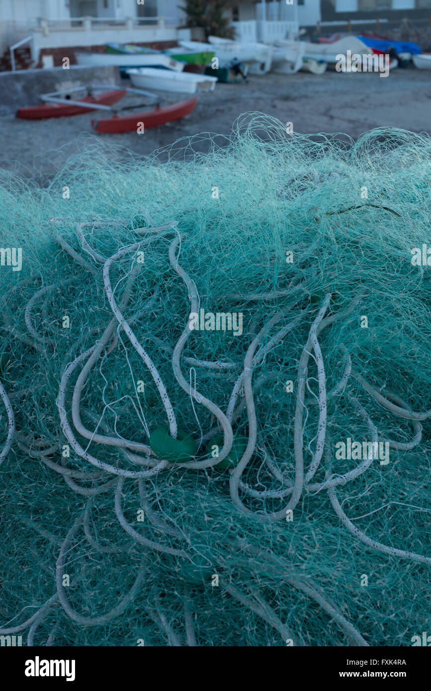 Traditional fishing nets in a small harbor Stock Photo - Alamy