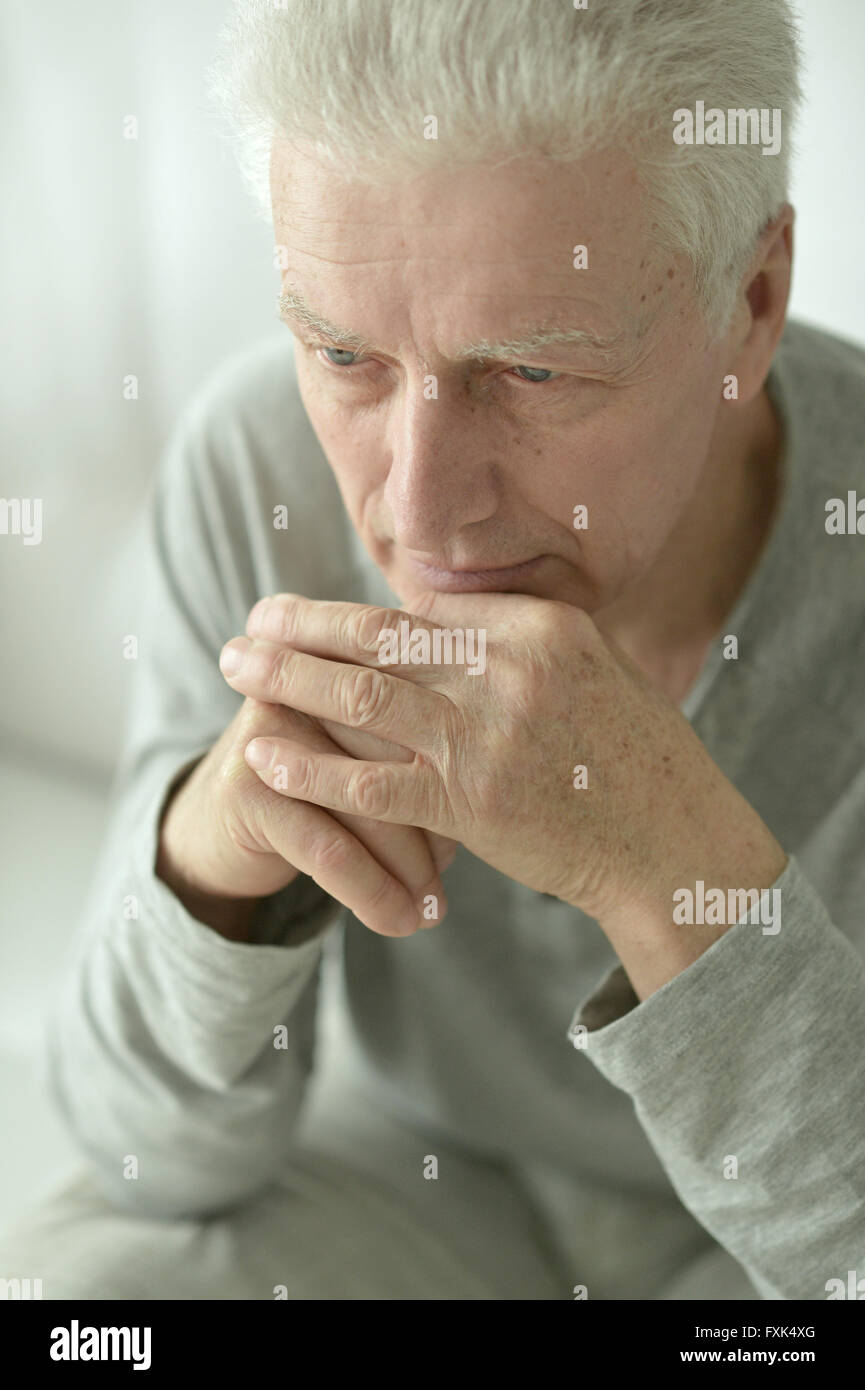 Sad senior man at home Stock Photo - Alamy