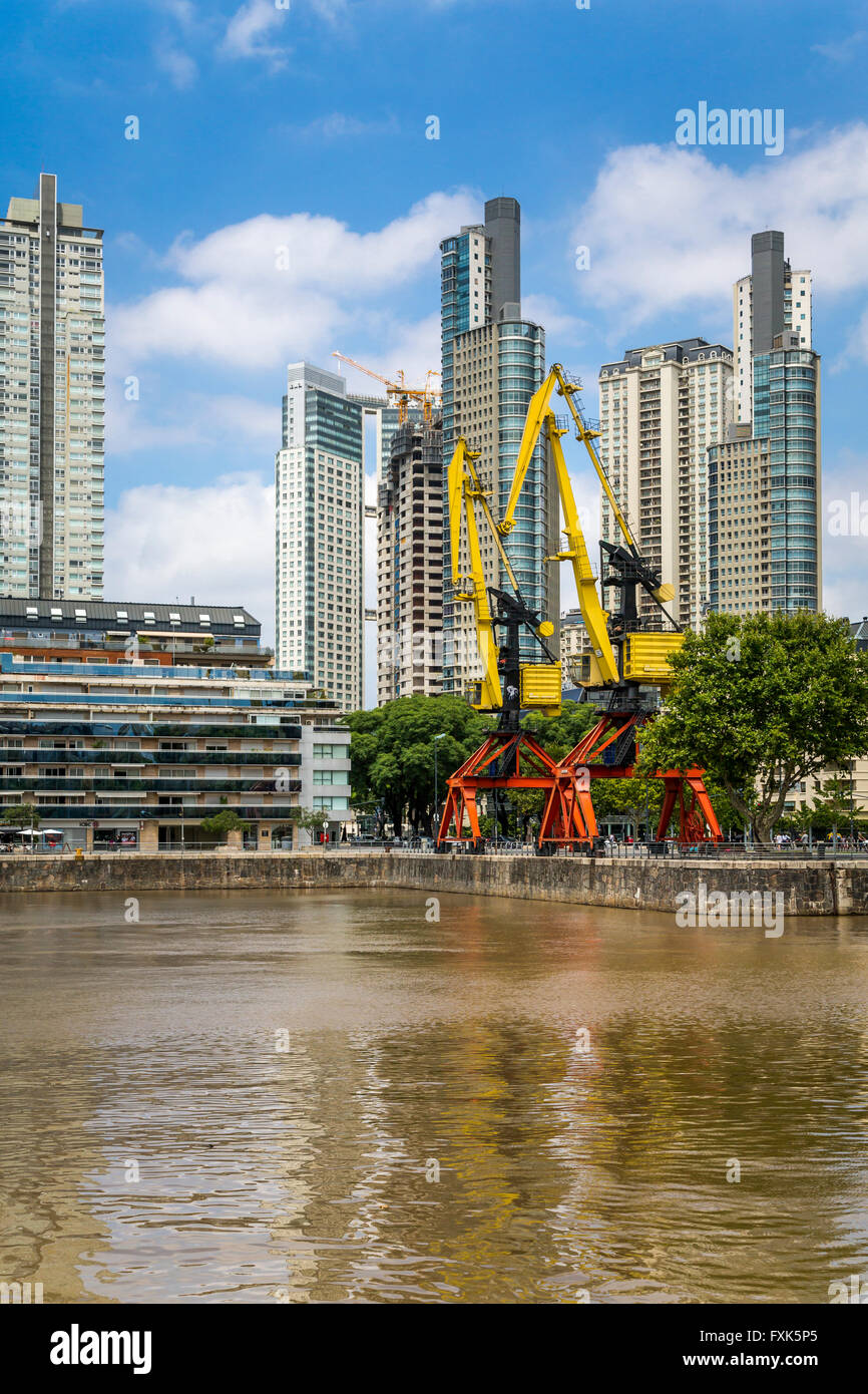 High-rise buildings and decommissioned cranes at the waterfront ...
