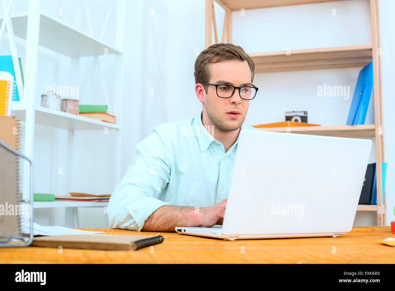 IT programmer working with laptop Stock Photo - Alamy