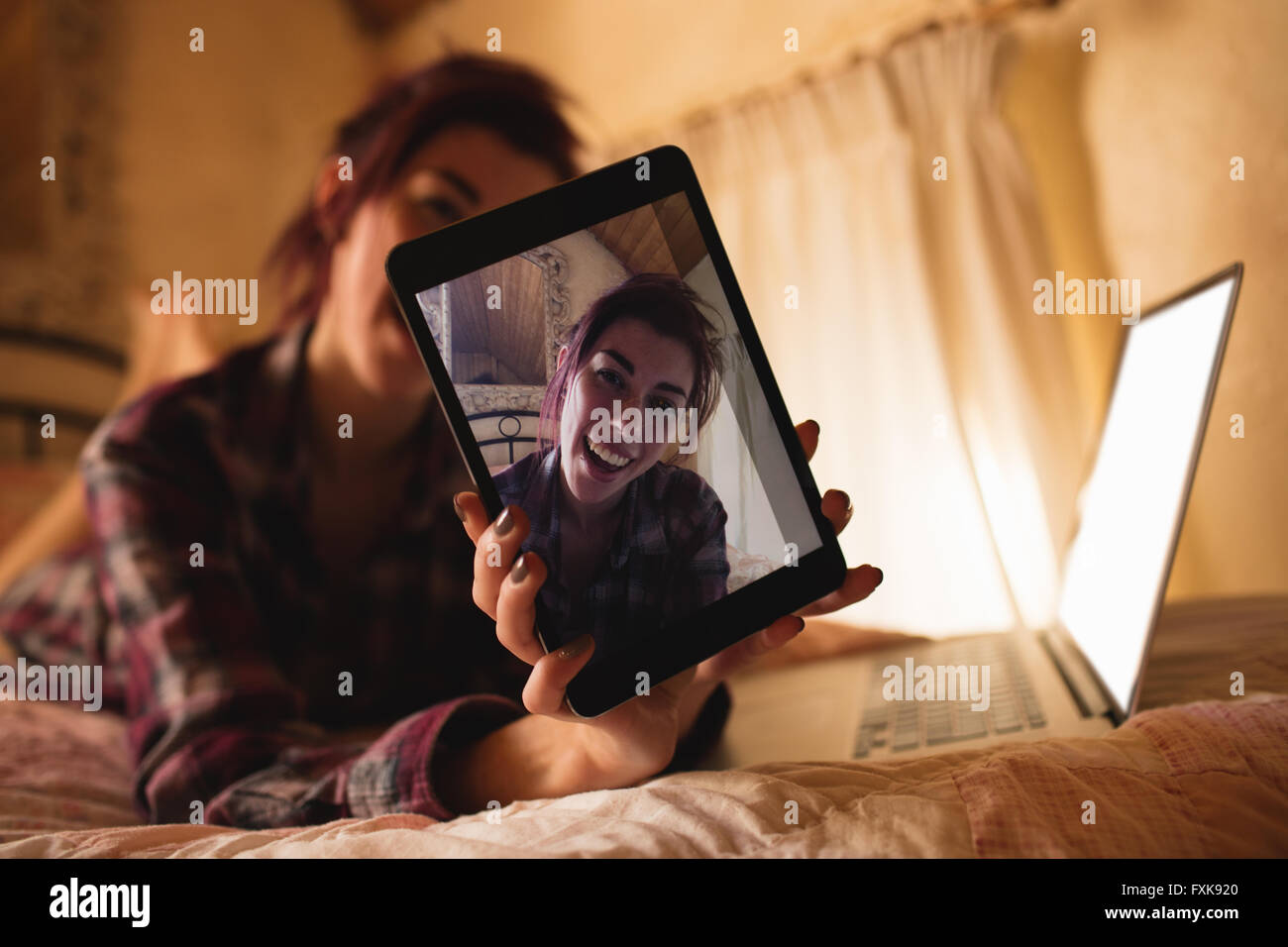 Young woman showing digital tablet Stock Photo - Alamy
