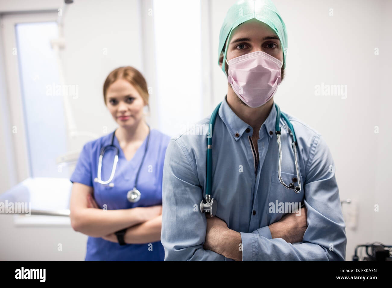 Portrait of vet standing in clinic Stock Photo - Alamy