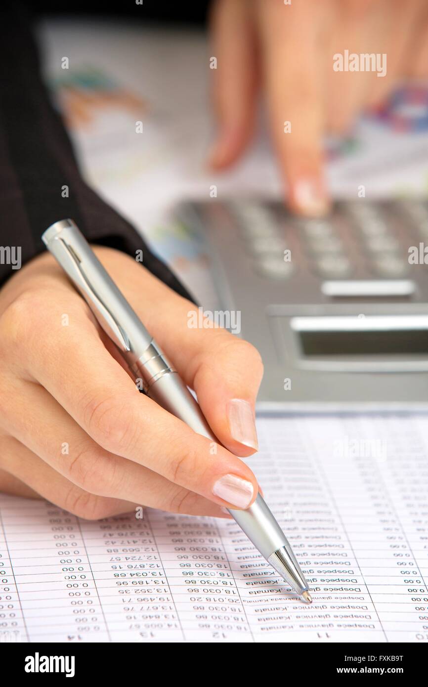 Female hand showing diagram on financial report with pen Stock Photo ...