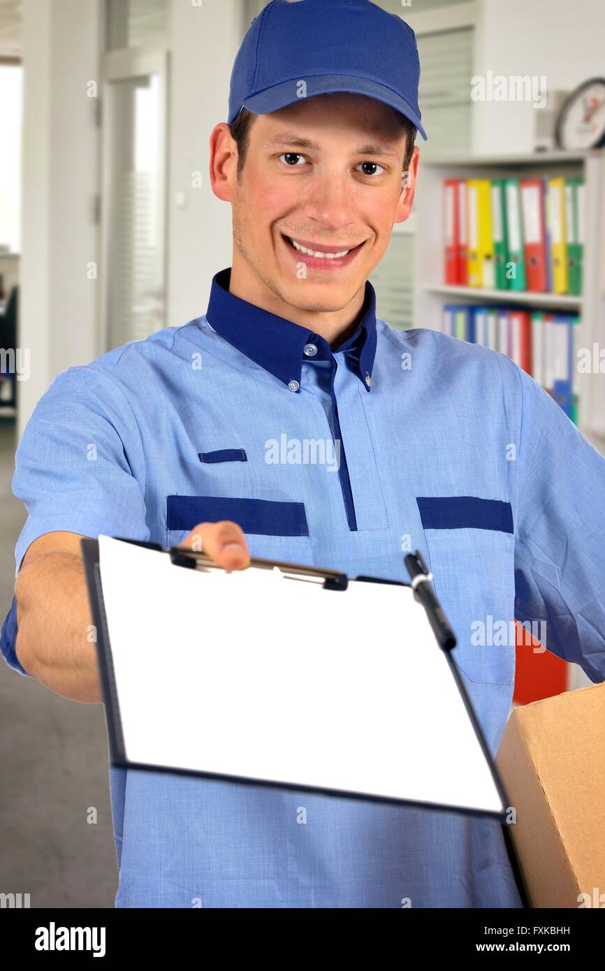 Smiling delivery man Stock Photo - Alamy