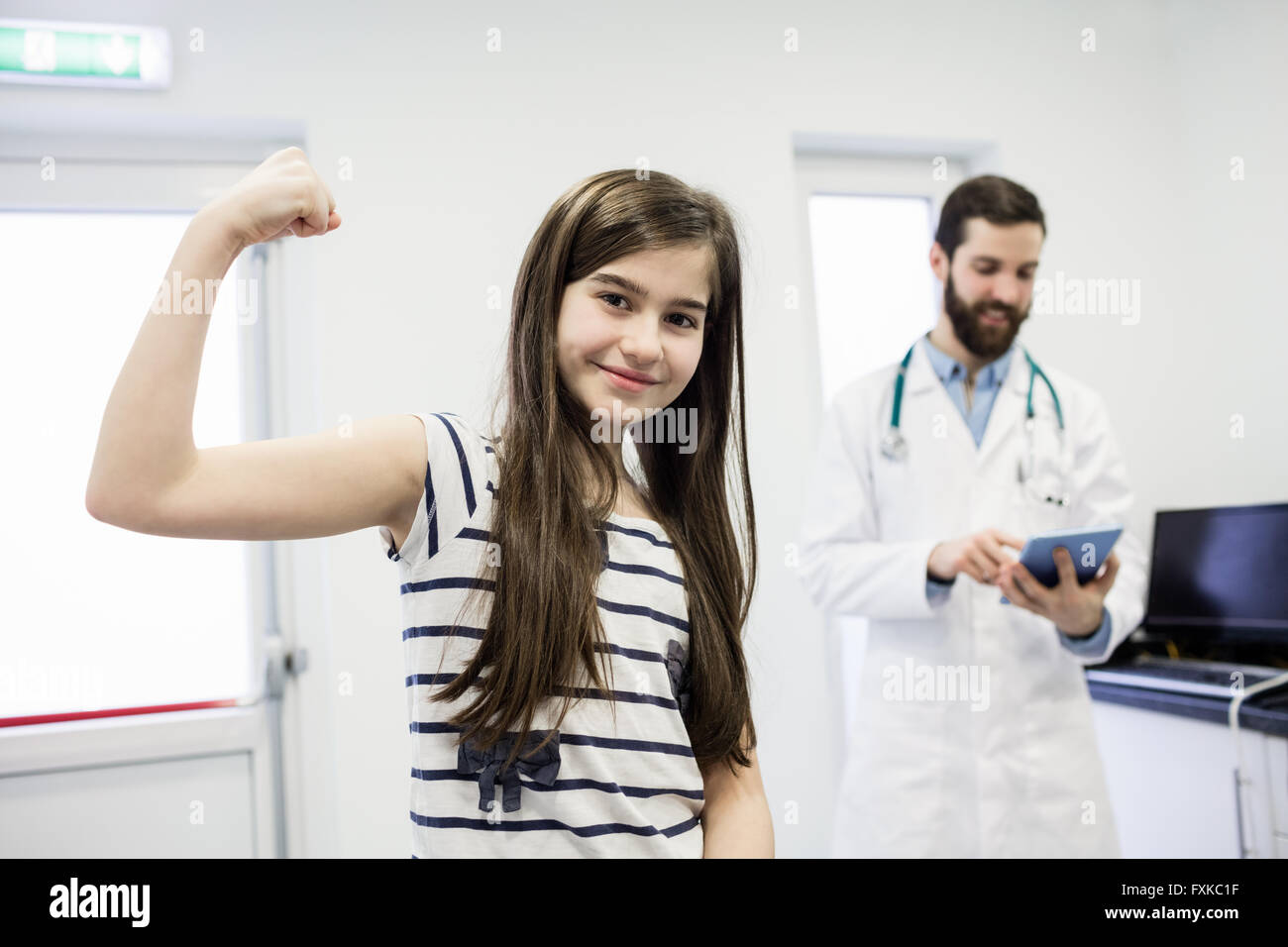 Portrait of girl showing her arm Stock Photo - Alamy