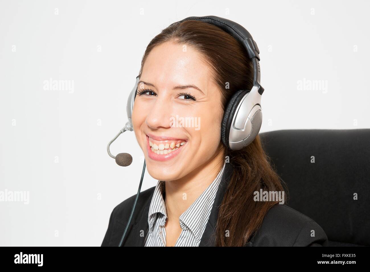 Young business dressed female telemarketer Stock Photo - Alamy