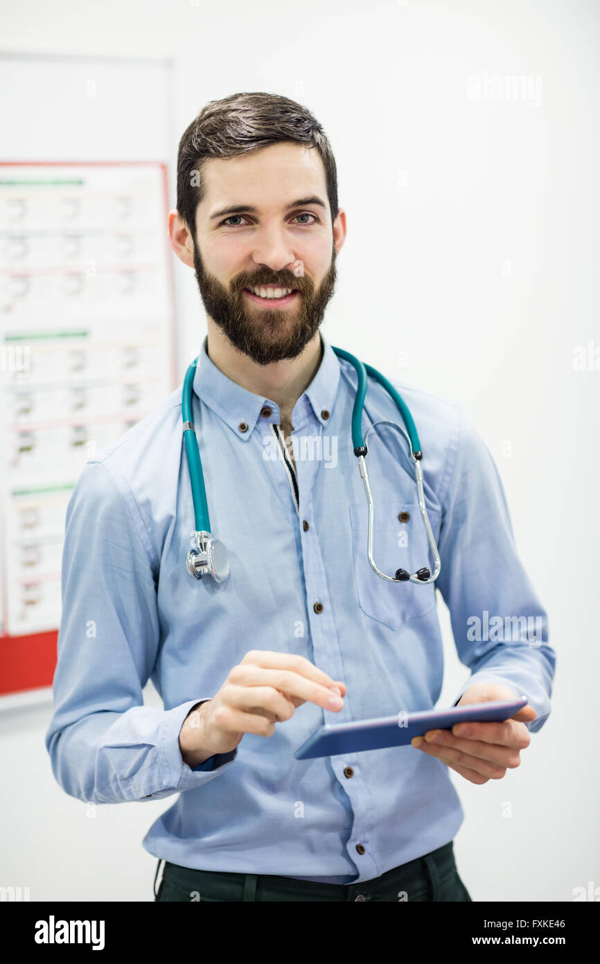 Portrait of doctor using digital tablet Stock Photo - Alamy