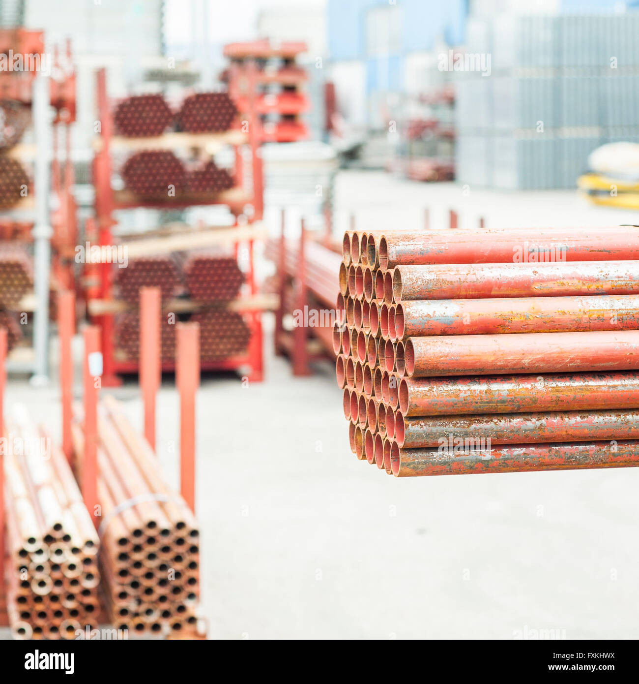 Stack of steel pipes for scaffolding in warehouse Stock Photo - Alamy