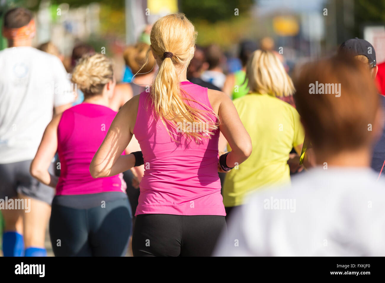 Group of people running Stock Photo - Alamy