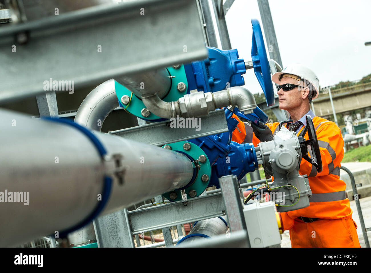Water worker on site in waste water treatment works Stock Photo - Alamy