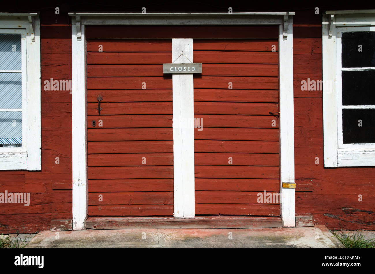Old red exterior wooden doors with a wooden closed sign Stock Photo - Alamy