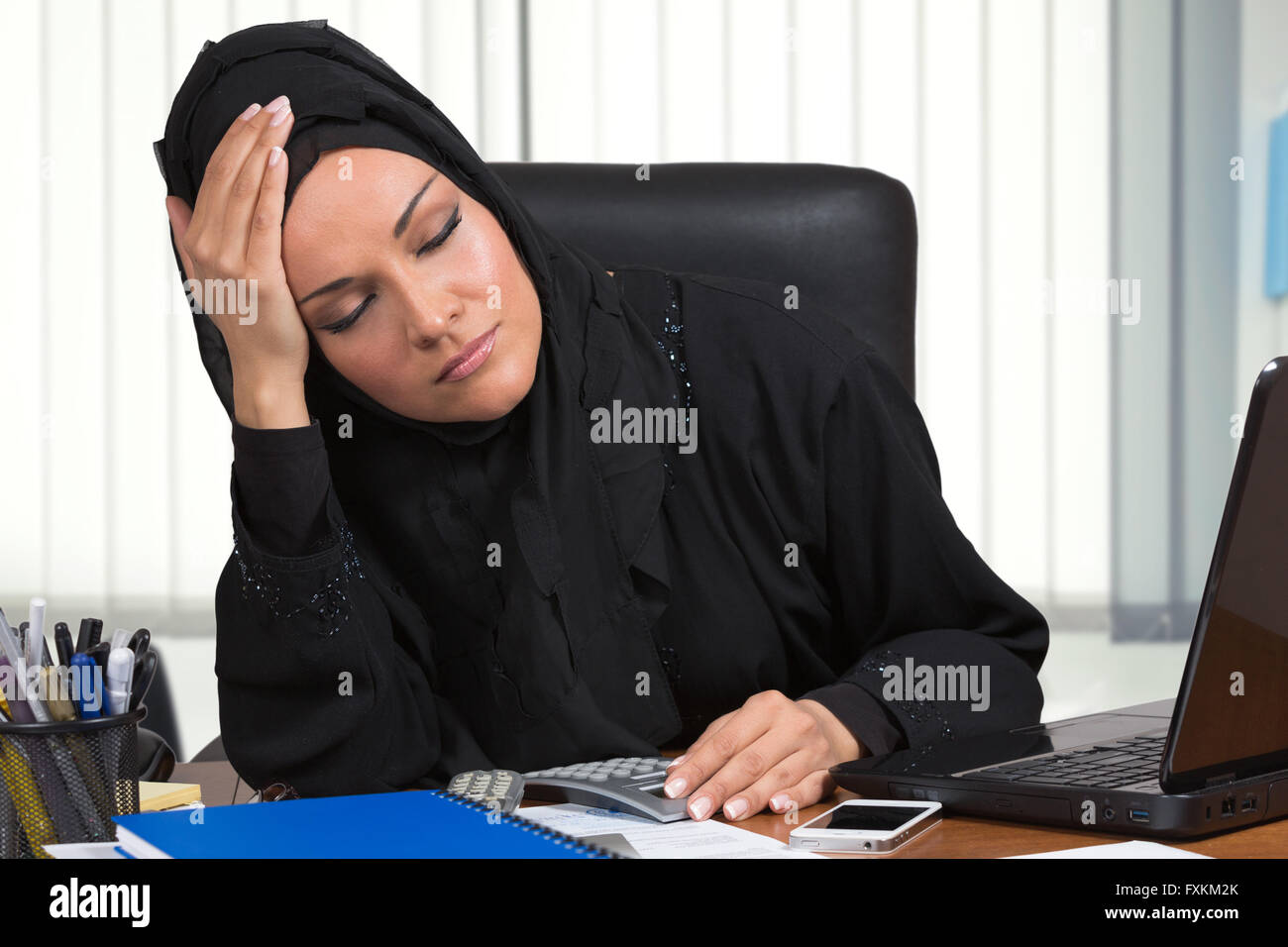 Arabic stressed out businesswoman Stock Photo - Alamy