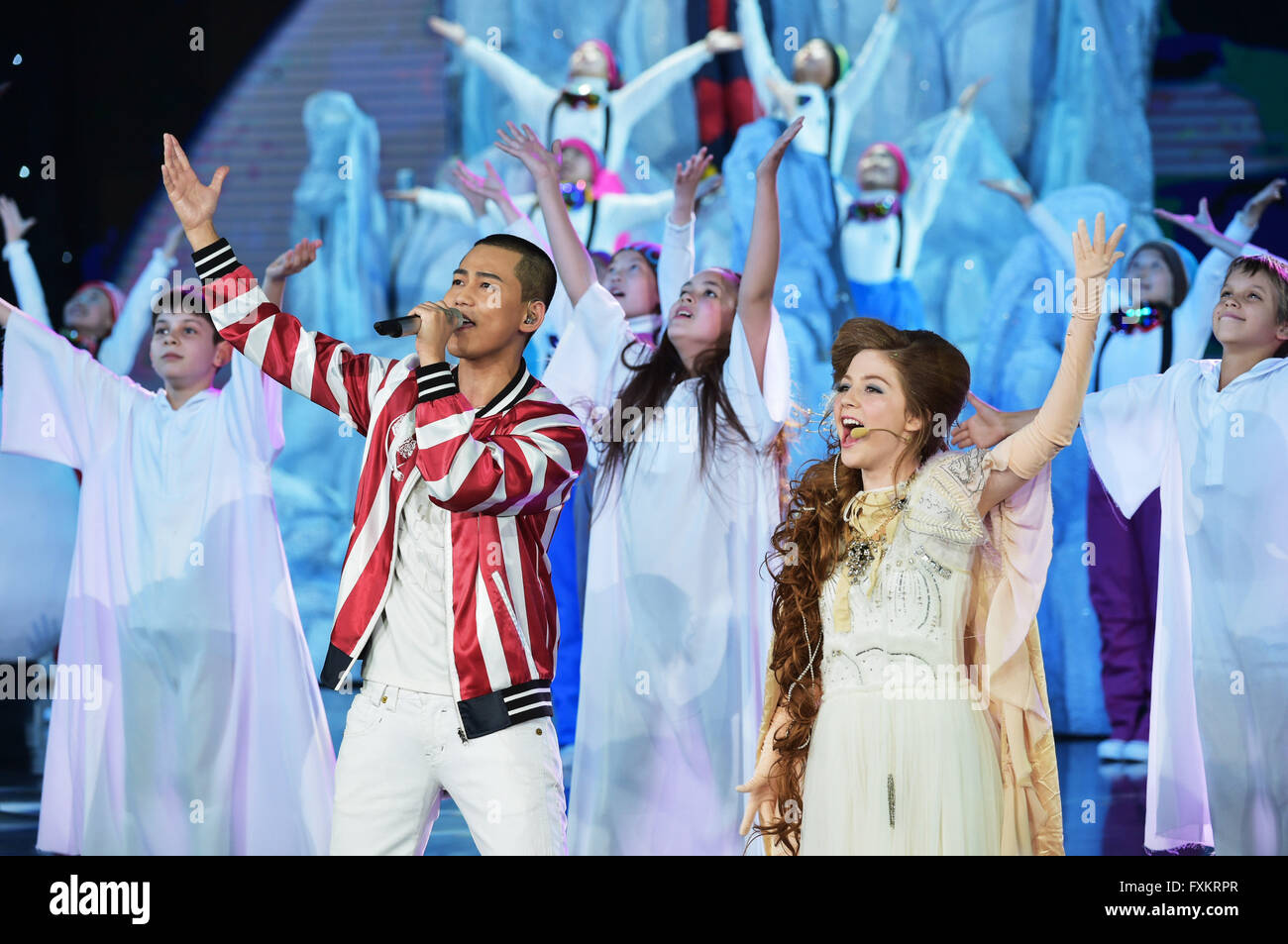 Beijing, China. 16th Apr, 2016. Singer Su Xing (L front) and young ...
