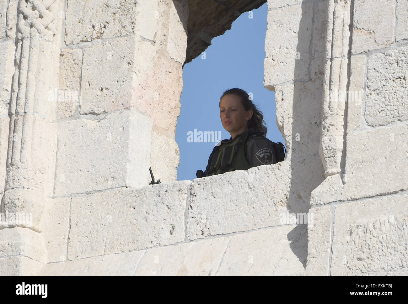 A soldier guards the Damascus Gate, one of the main entrances to the ...